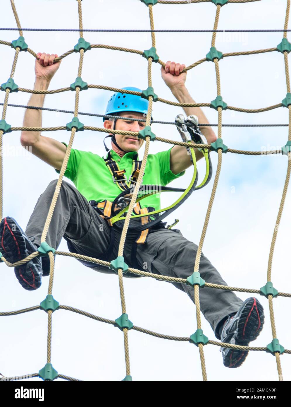 Funny afternoon in high ropes course Stock Photo - Alamy
