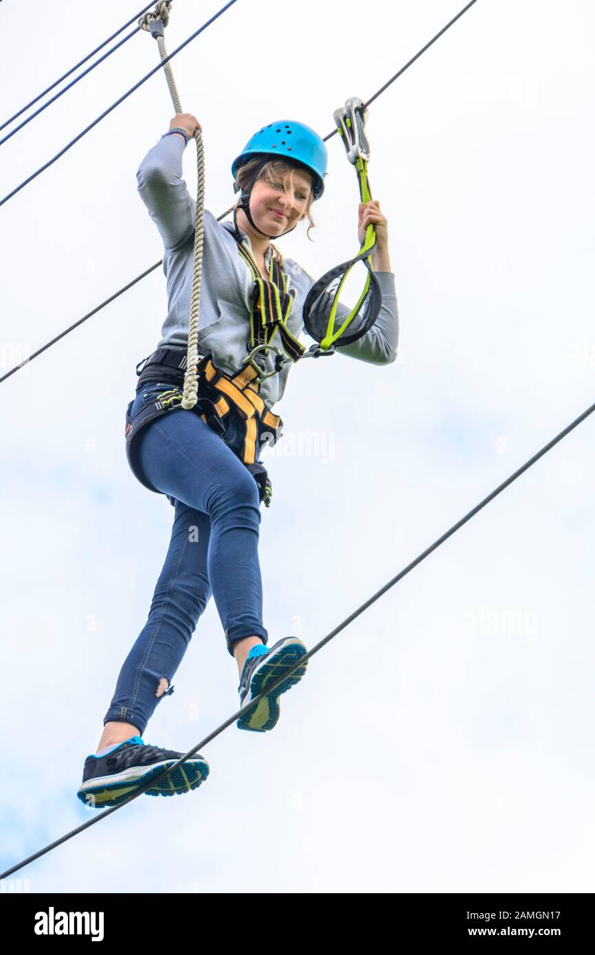 Funny afternoon in high ropes course Stock Photo - Alamy