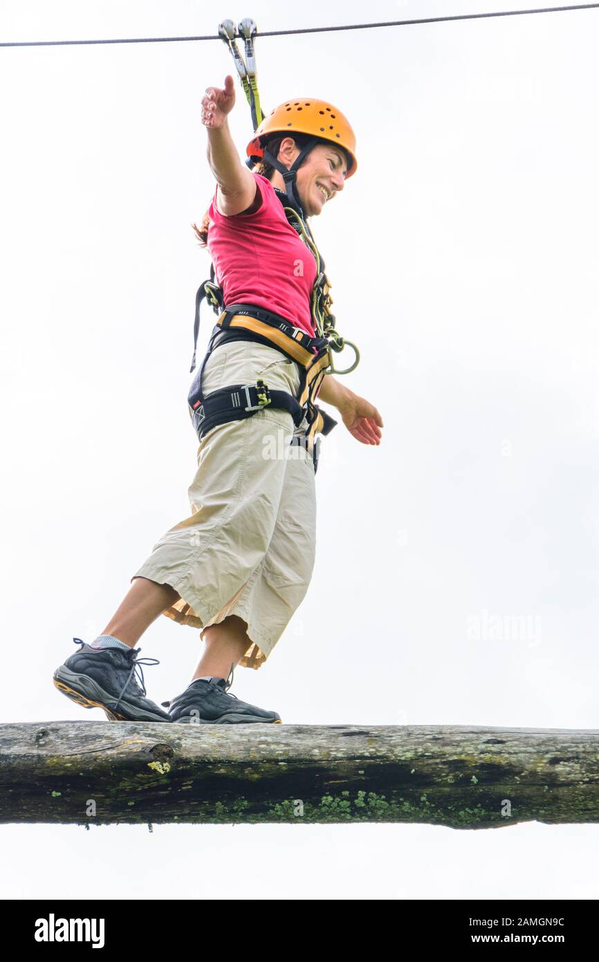 Funny afternoon in high ropes course Stock Photo - Alamy