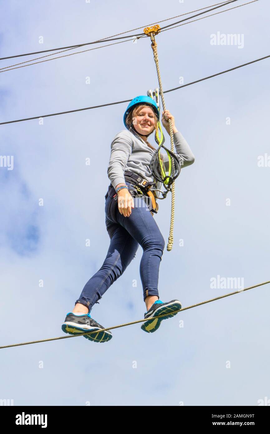 Funny afternoon in high ropes course Stock Photo - Alamy