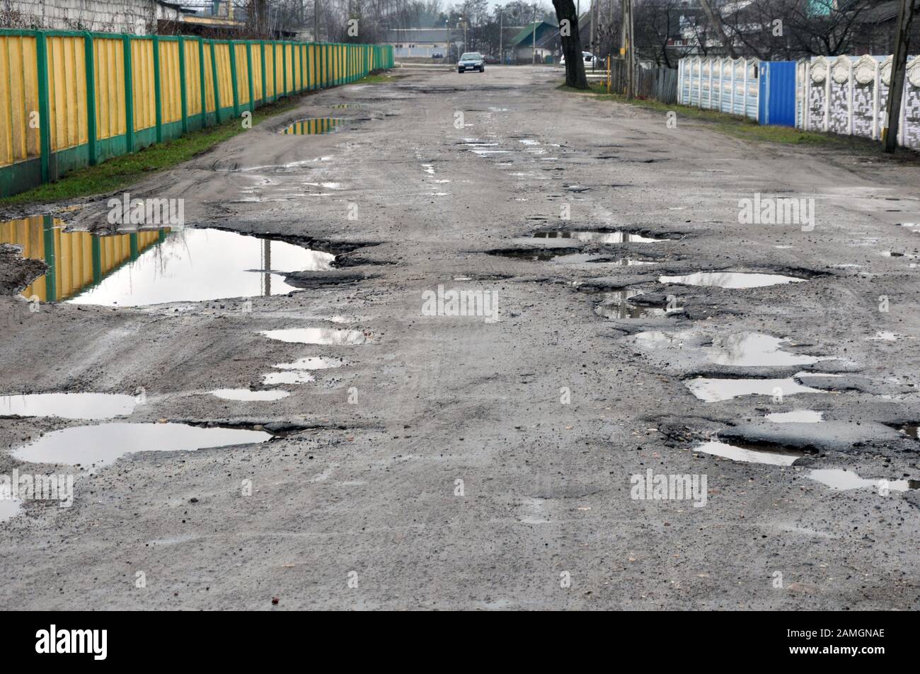 Poor road conditions. Holes in the asphalt, the risk of driving a car ...