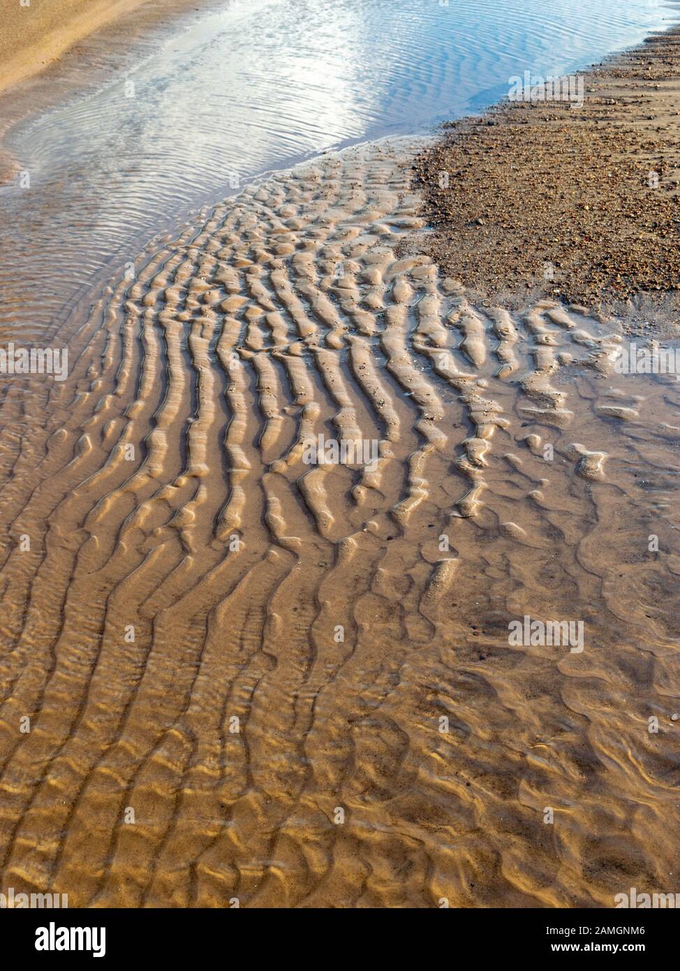abstract texture with sand texture, sea water and sand formations on ...