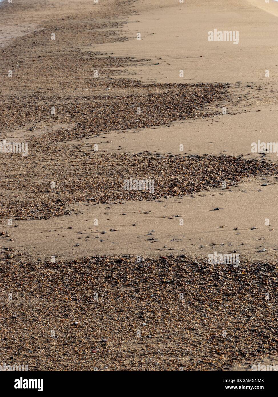 abstract texture with sand texture, sea water and sand formations on ...