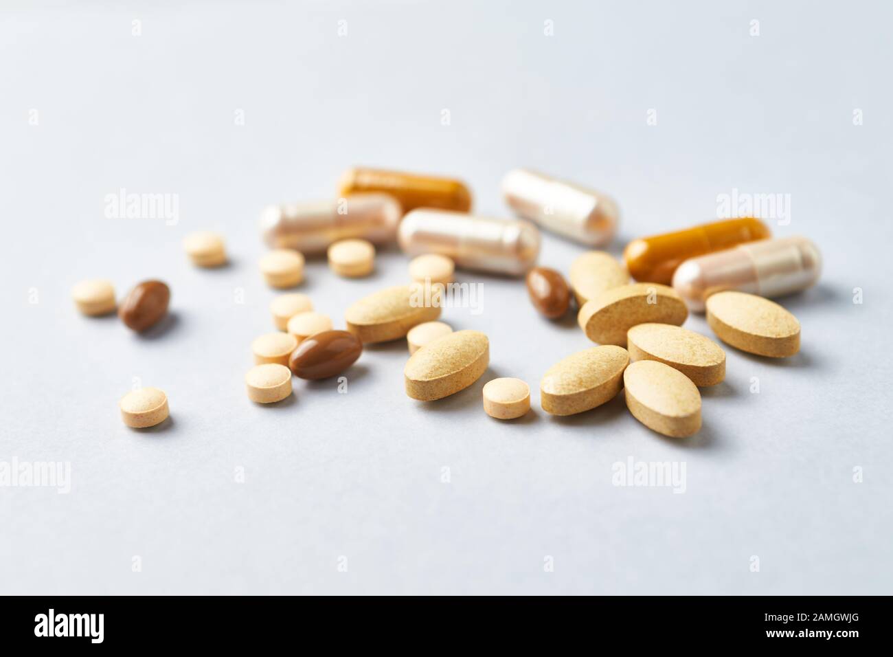 Vitamins and supplements on bright paper background. Concept for a ...