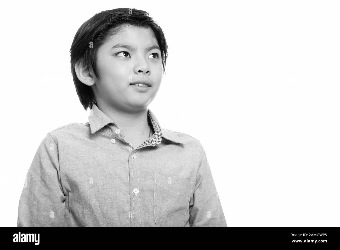 Studio shot of cute Japanese boy thinking Stock Photo - Alamy