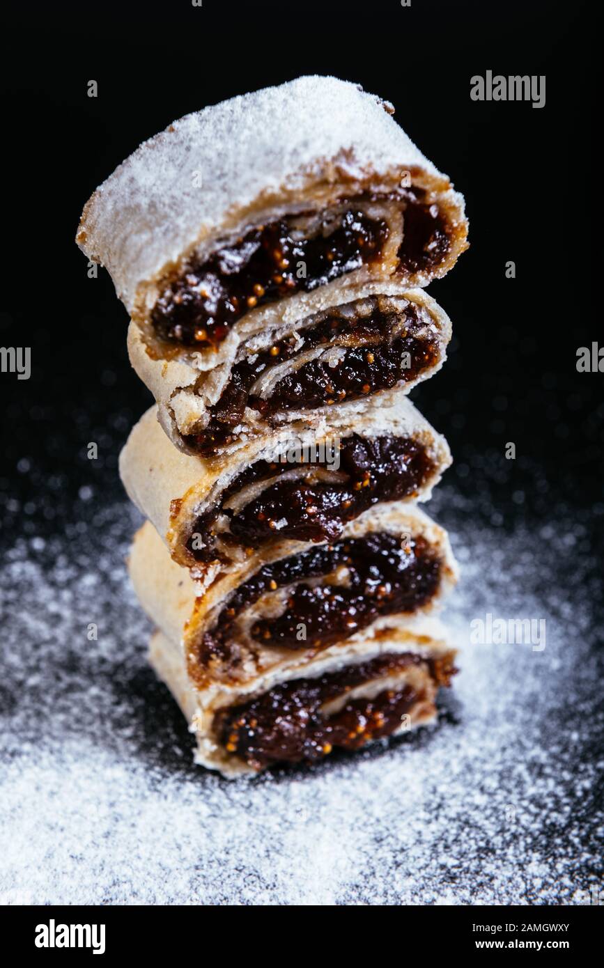 Fresh fig rolls on the dark background Stock Photo - Alamy