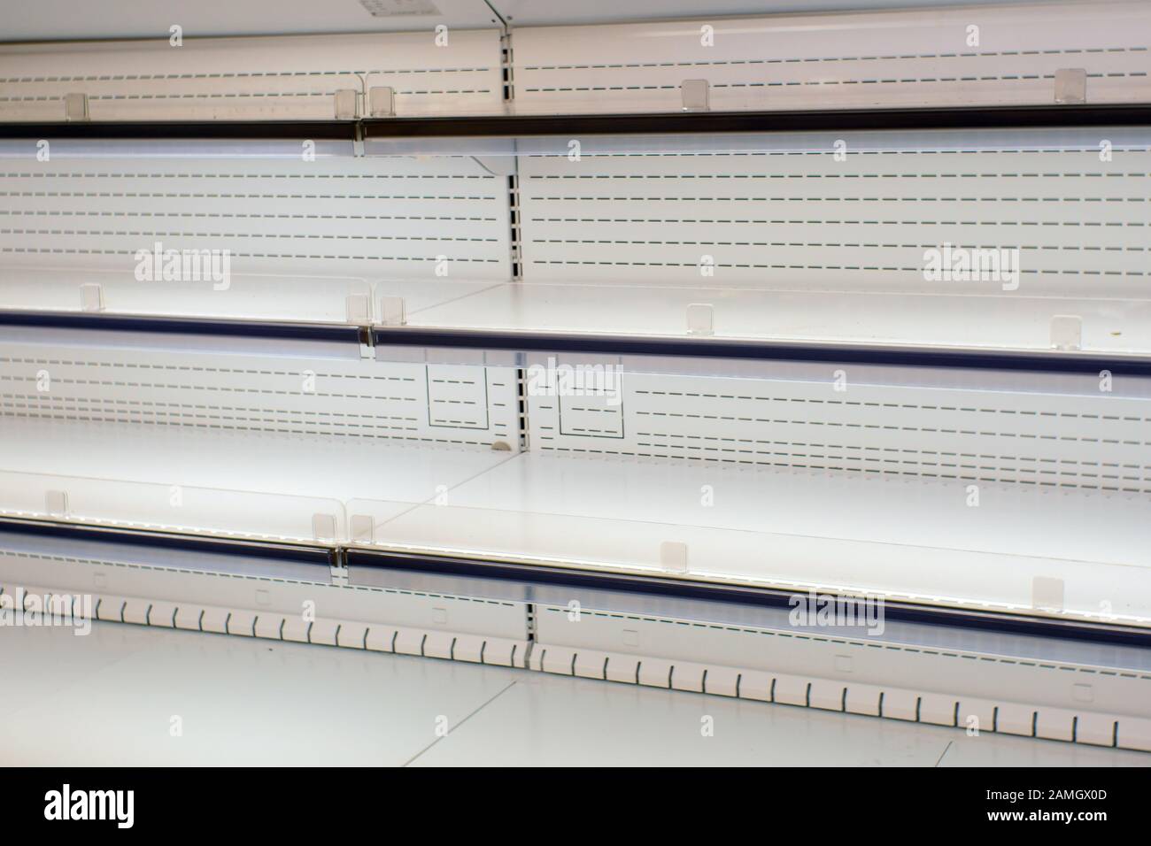 empty white shelves in a store, a supermarket. sale of goods, shopping ...