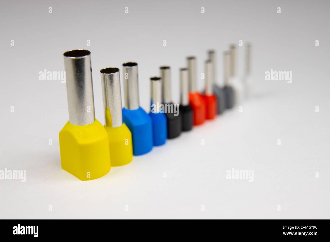 Multicolored metal-plastic tips for crimping stranded electrical wires ...