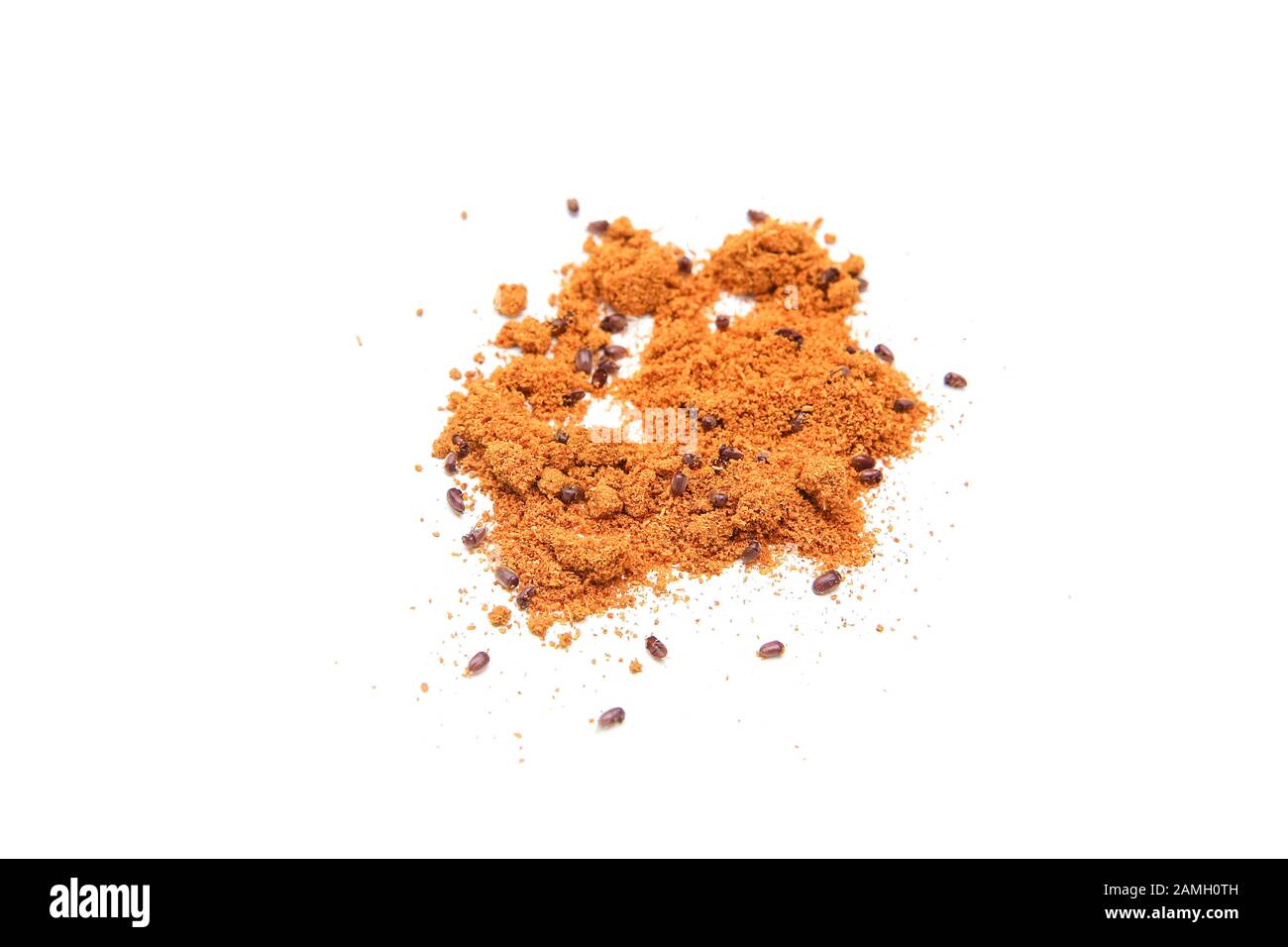 The red curry powder infested with food beetles. A detail od the ...