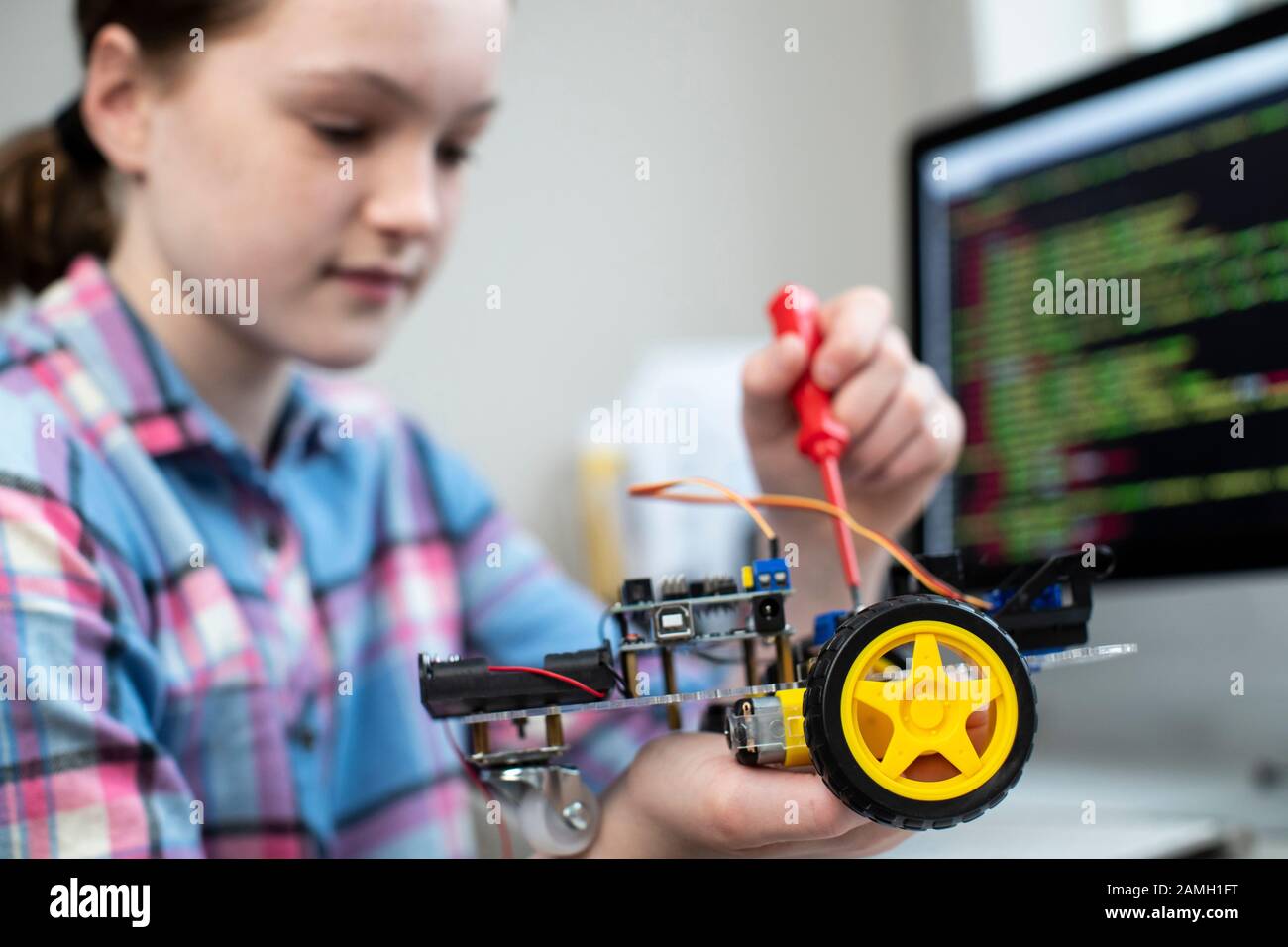 Female Pupil Building Robot Car In School Science Lesson Stock Photo ...
