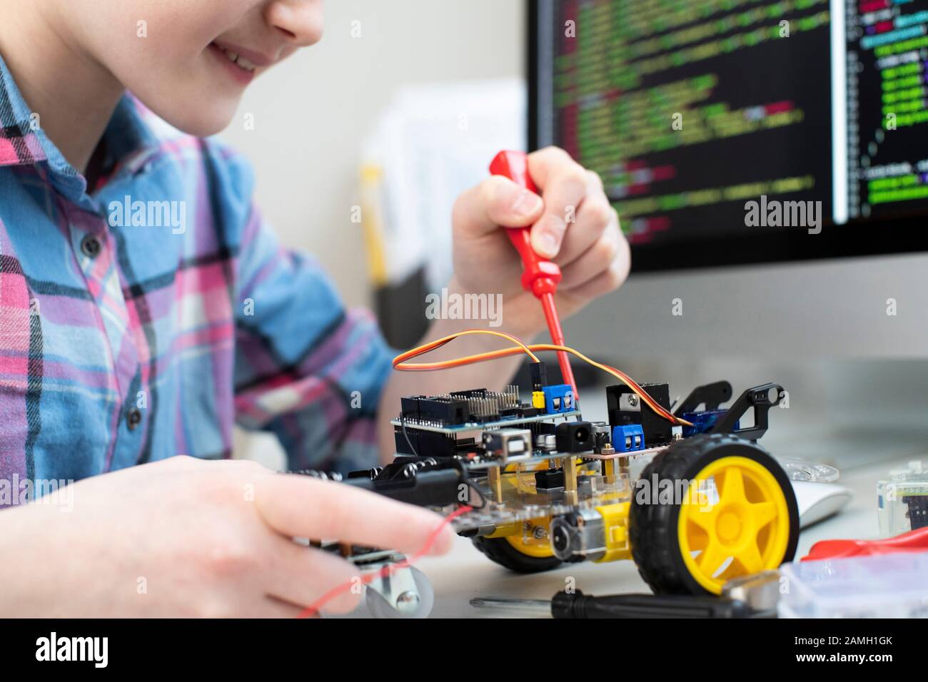 Female Pupil Building Robot Car In School Science Lesson Stock Photo ...