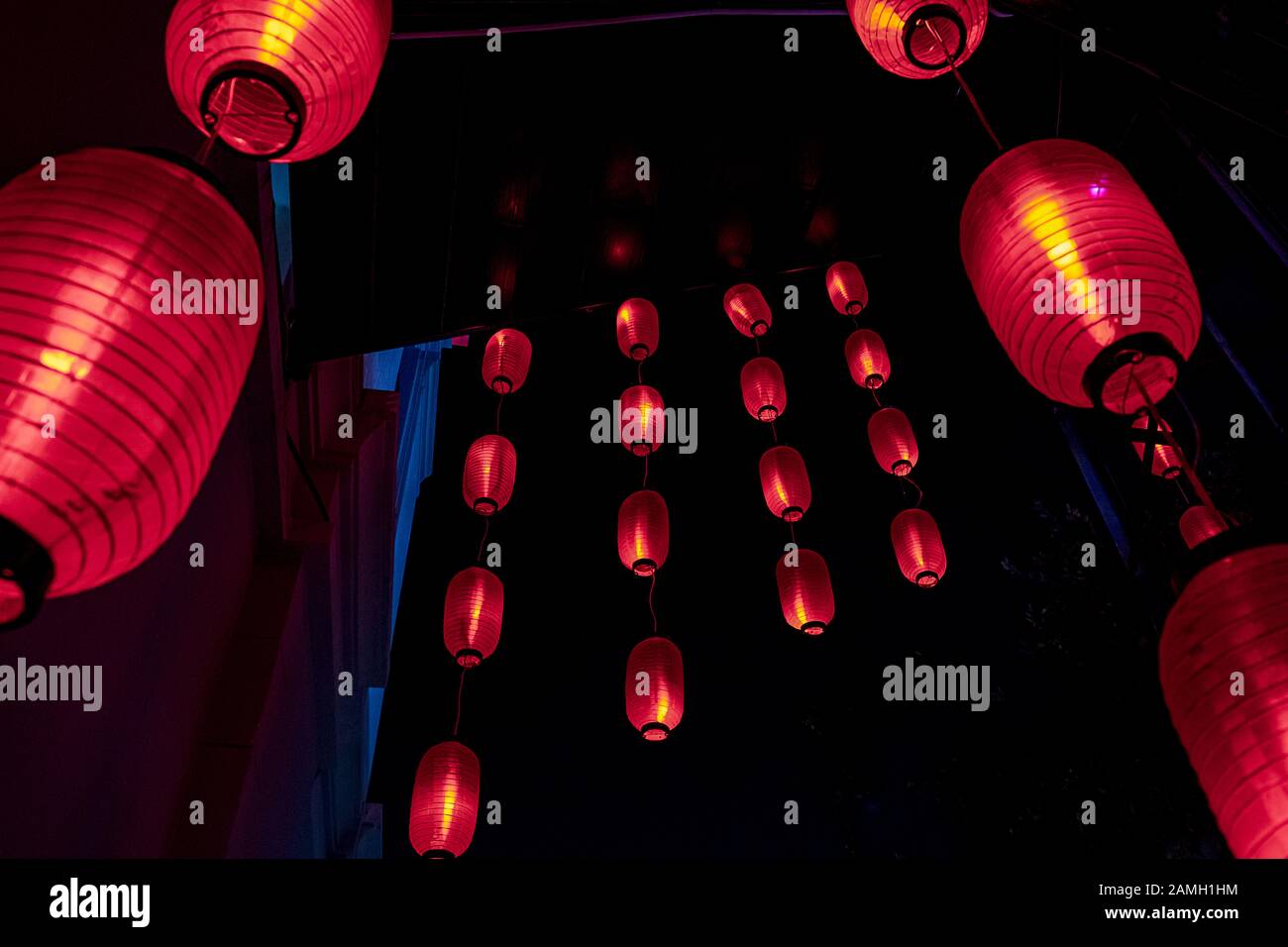 Chinese lanterns with red light at night background Stock Photo - Alamy