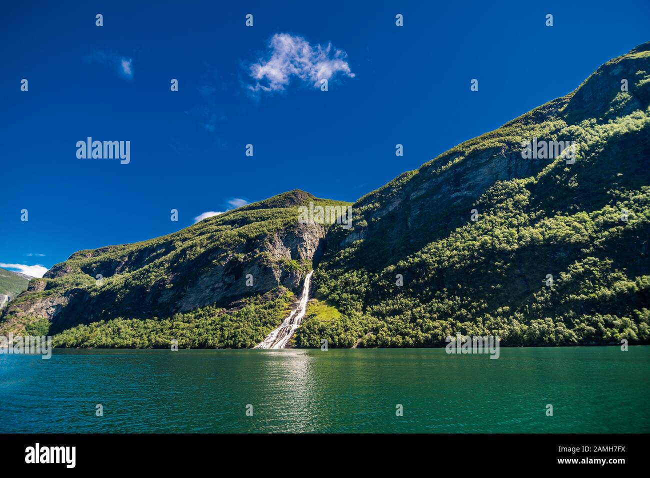The waterfall over Geirangerfjord, located near the Geiranger village ...