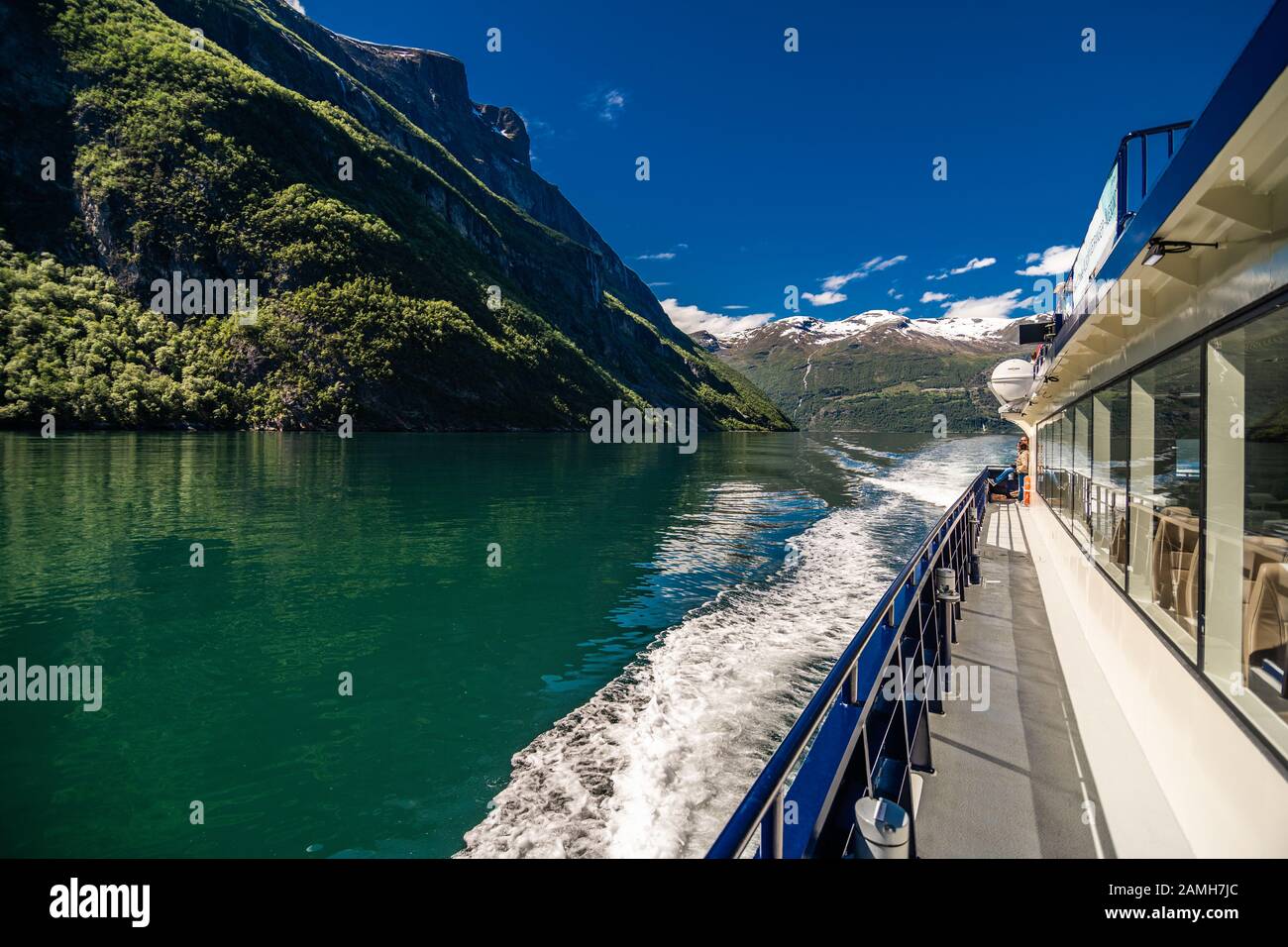 Geiranger, Norway - June, 2019: Hurtigruten cruise liner sailing on the ...