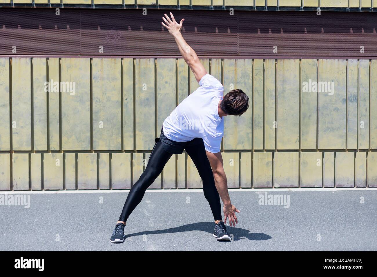Man stretches leg before hi-res stock photography and images - Alamy