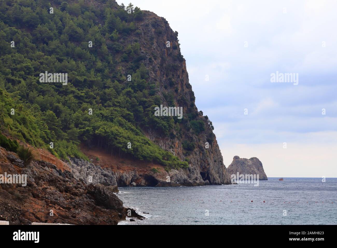 High steep rocky sea berg Stock Photo - Alamy
