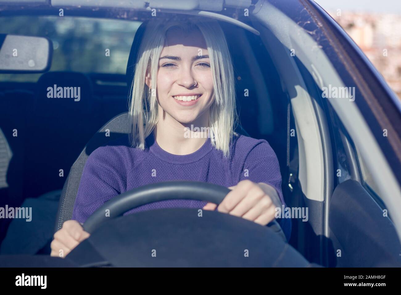 Beautiful Smiling woman driving car, attractive girl sitting in ...