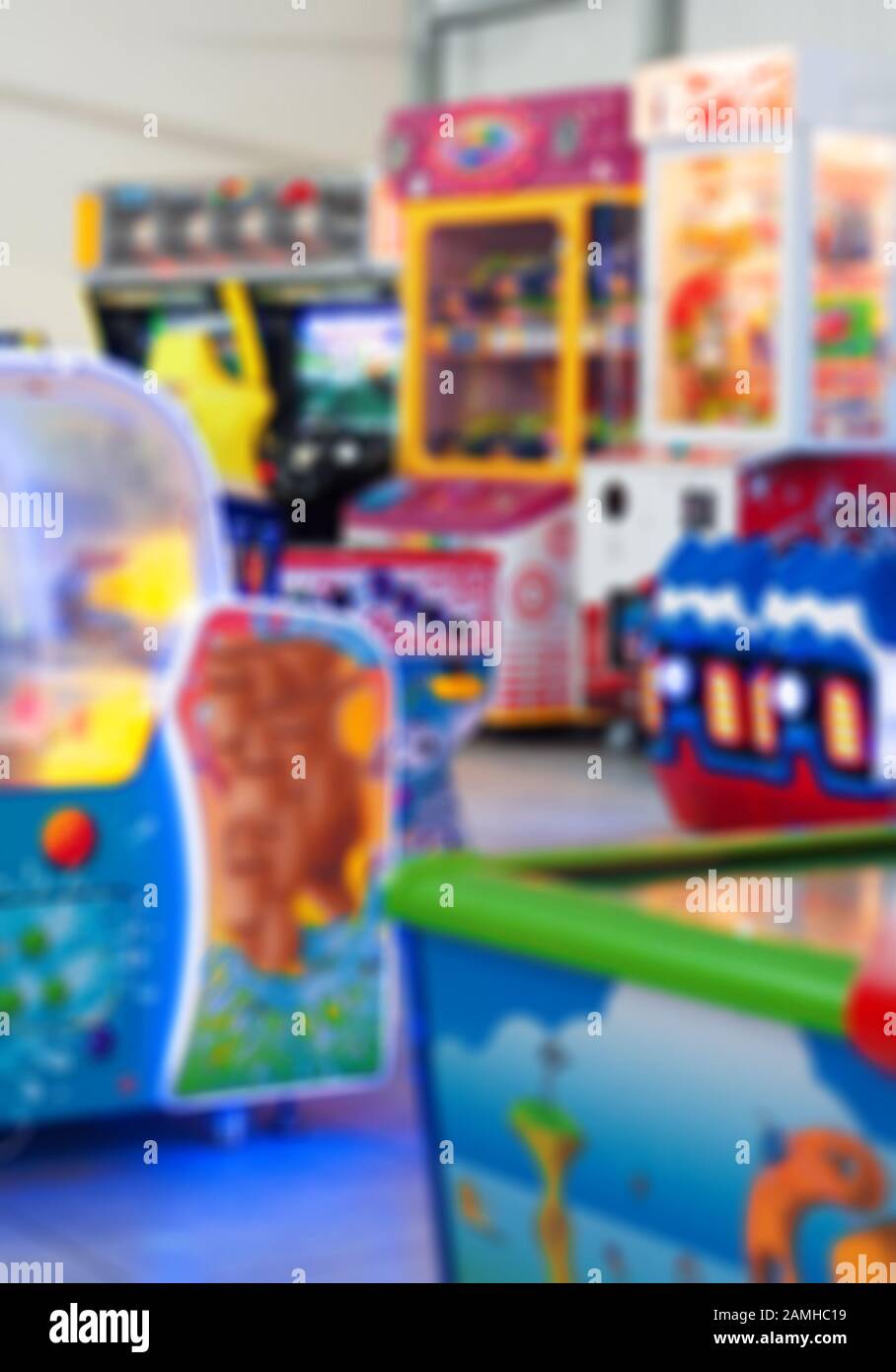 Many arcade machines in amusement park. Blurred photo Stock Photo - Alamy