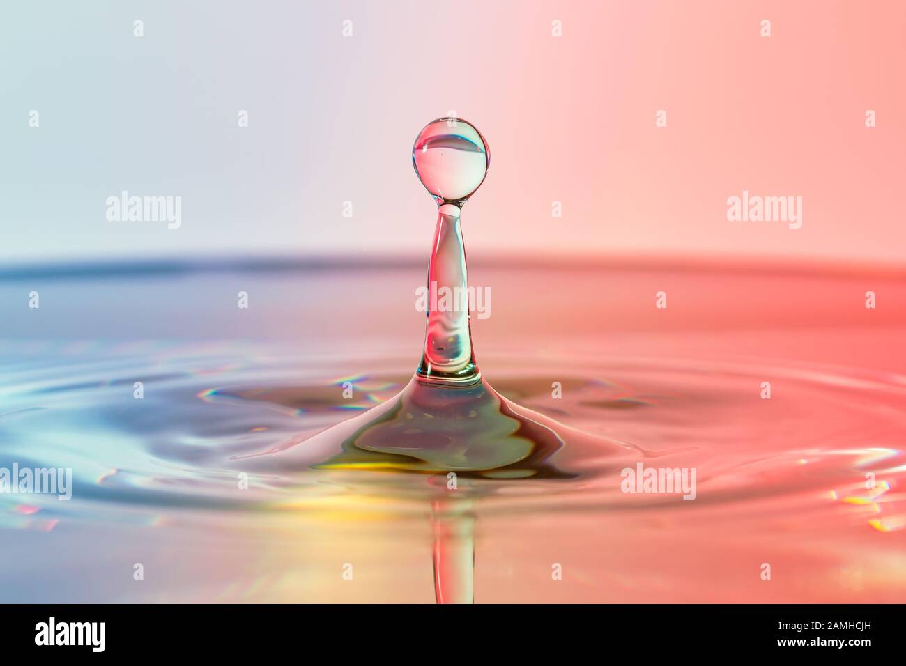 High speed water drop photograph with blue and red colors Stock Photo ...