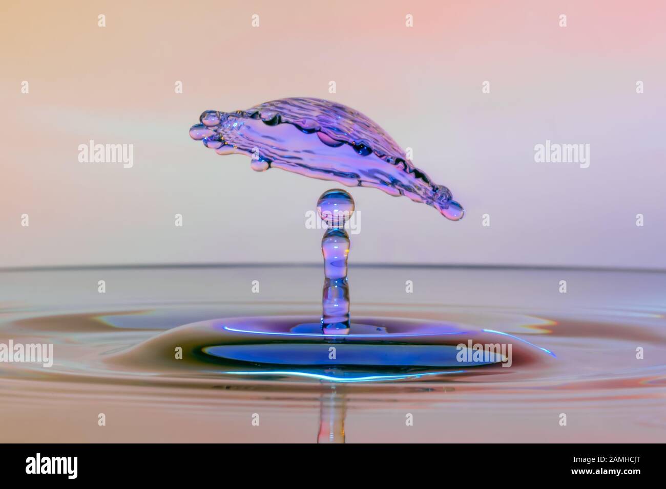 High speed water drop photograph with colliding drops Stock Photo - Alamy