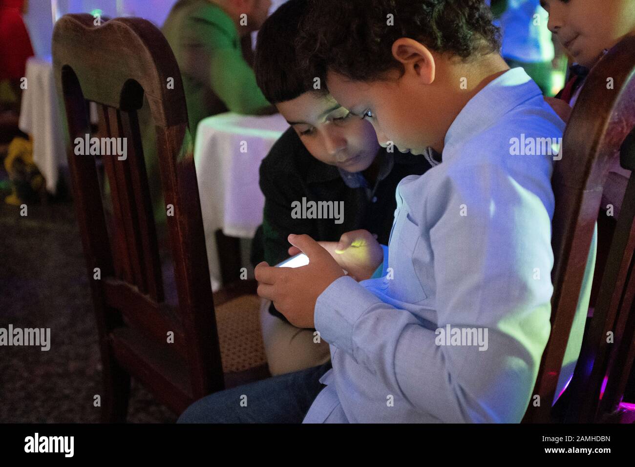 Cuban boys with cell phone Stock Photo - Alamy
