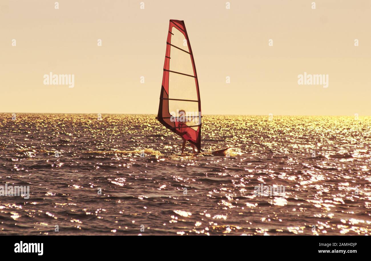 Windsurfing on sea and blue sky background hi-res stock photography and ...