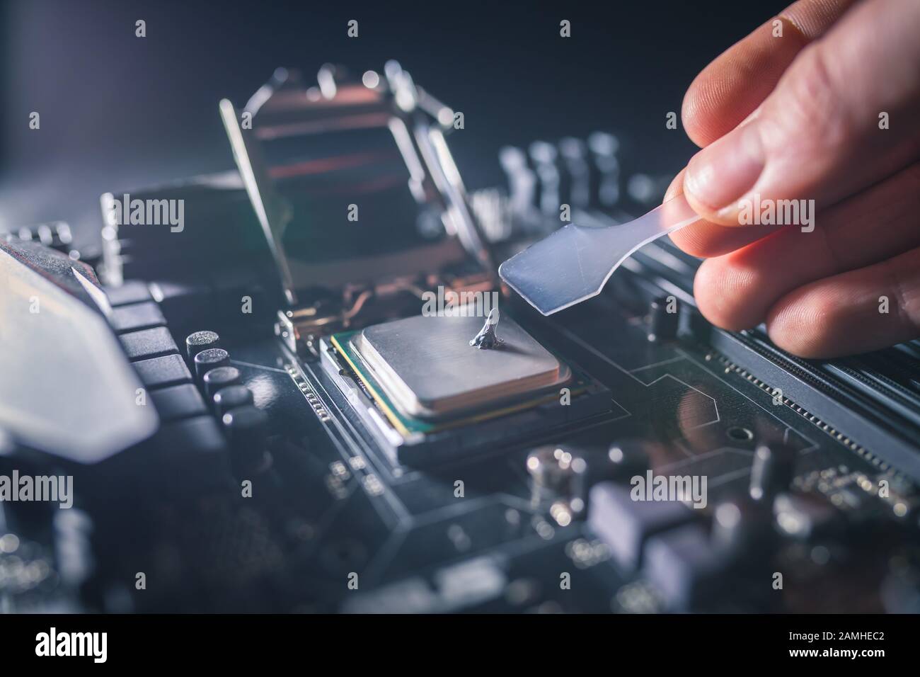 Application of thermal paste on the laptop processor chip for high ...