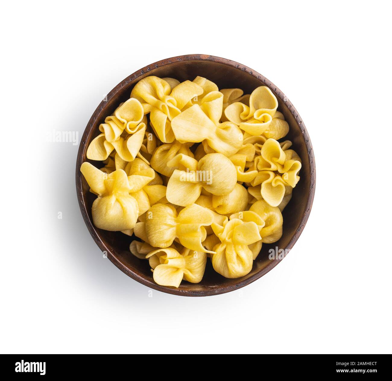 Italian stuffed pasta in bowl. Sacchettini pasta isolated on white ...