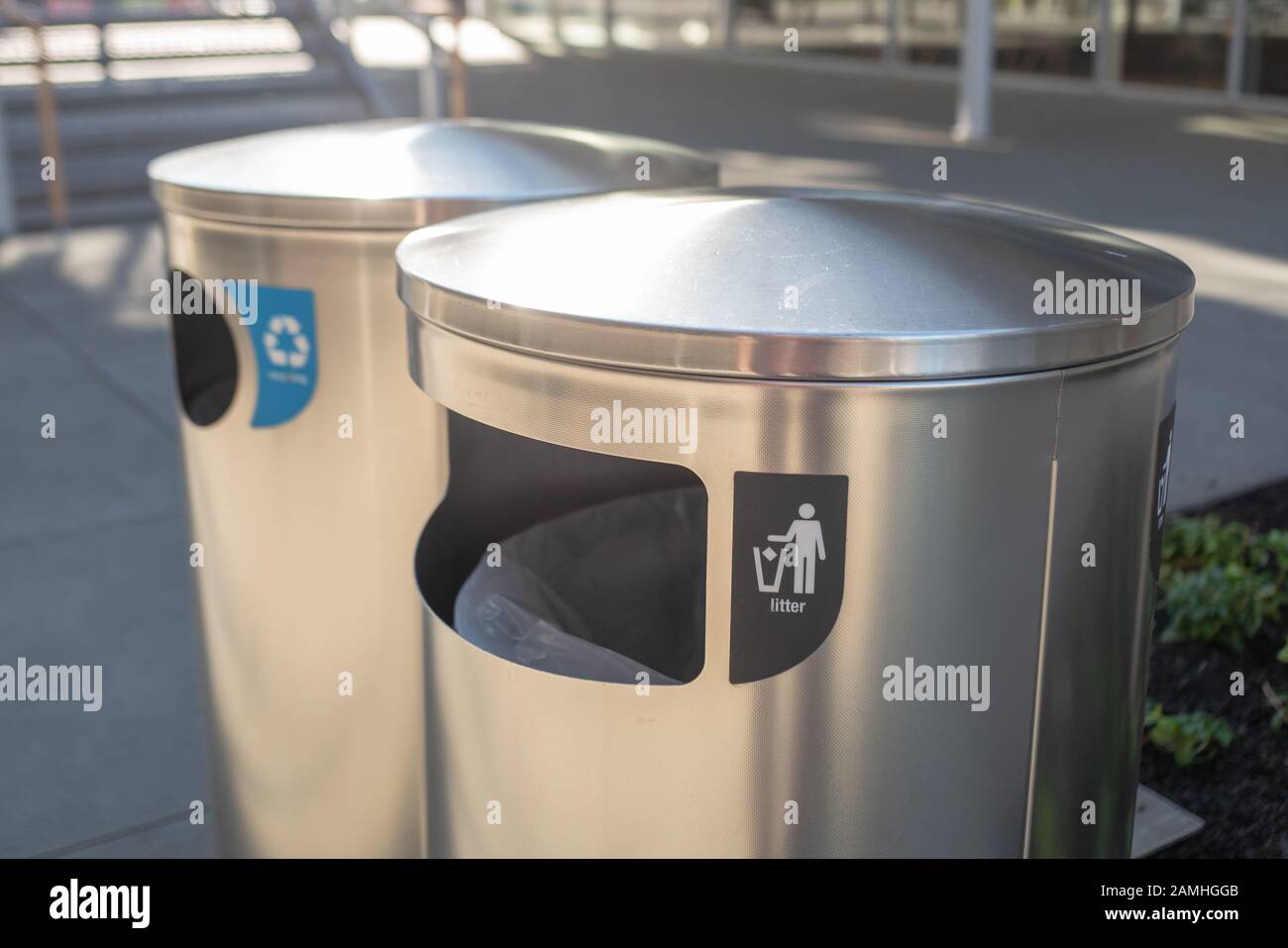 Close-up of stainless steel outdoor garbage bin at a shopping mall with ...