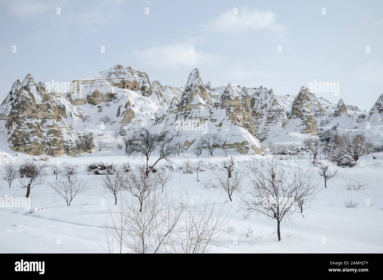 Panorama of hills and geological rock formations under snow in ...