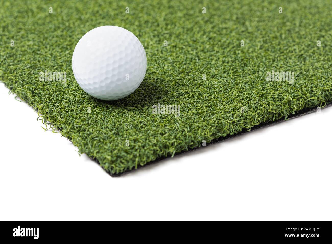 Golf Ball Resting on Section of Artificial Turf Grass On White ...