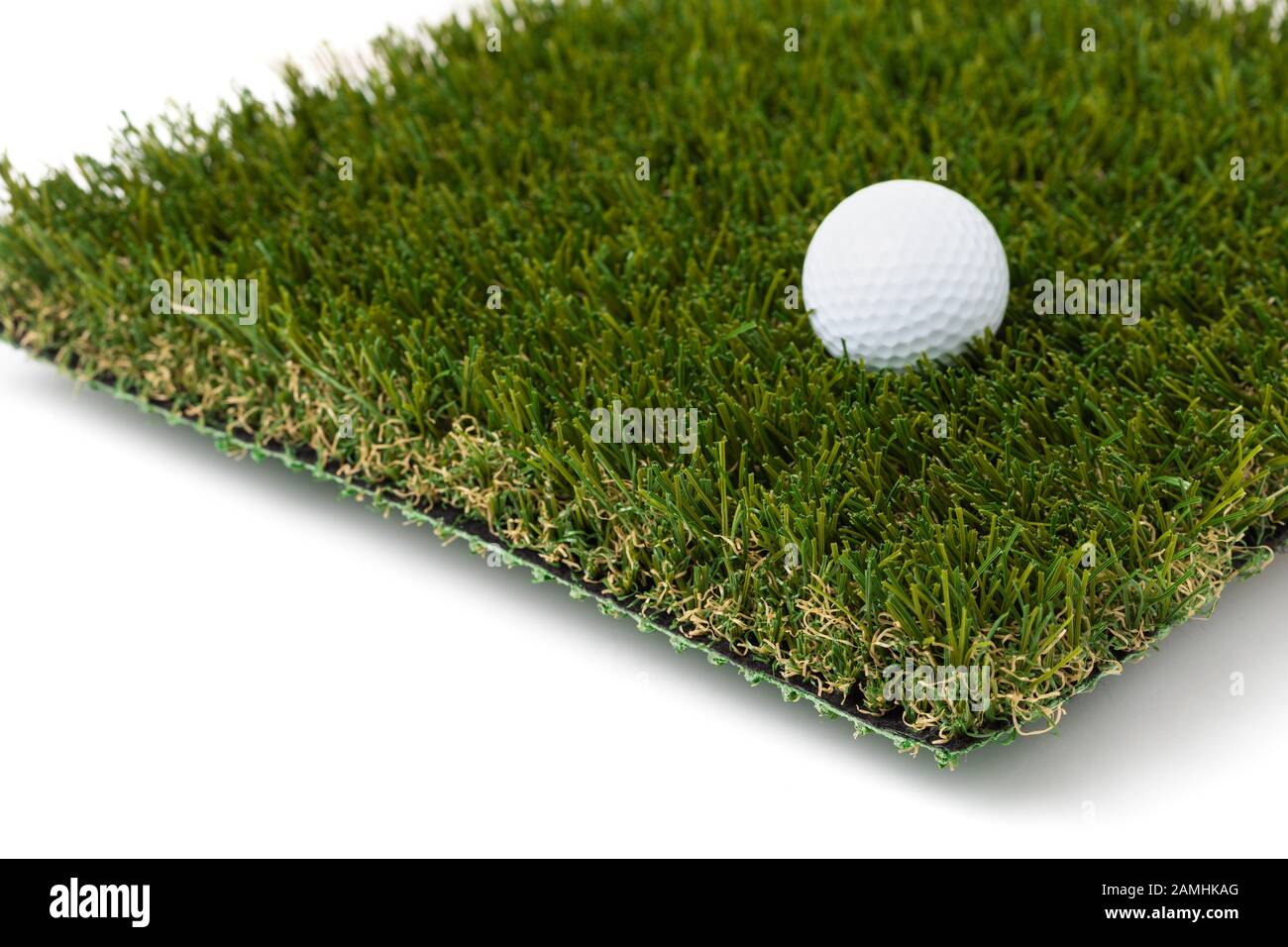 Golf Ball Resting on Section of Artificial Turf Grass On White ...