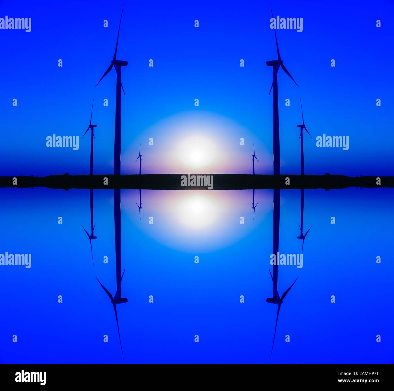 Mirror image silhouette of large wind turbine farm at sunset, Dexter ...