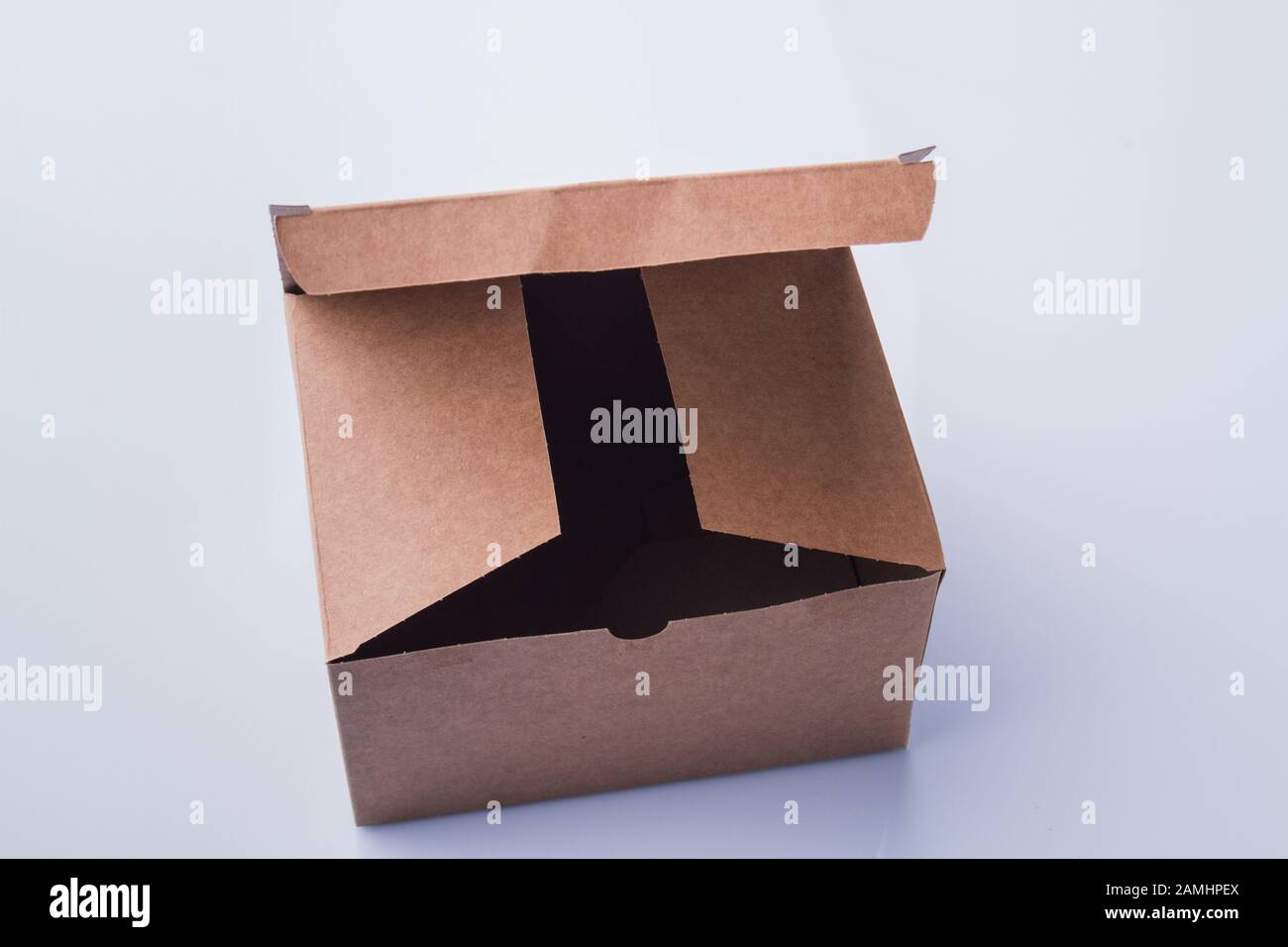 Half-opened empty cardboard carton box Stock Photo - Alamy