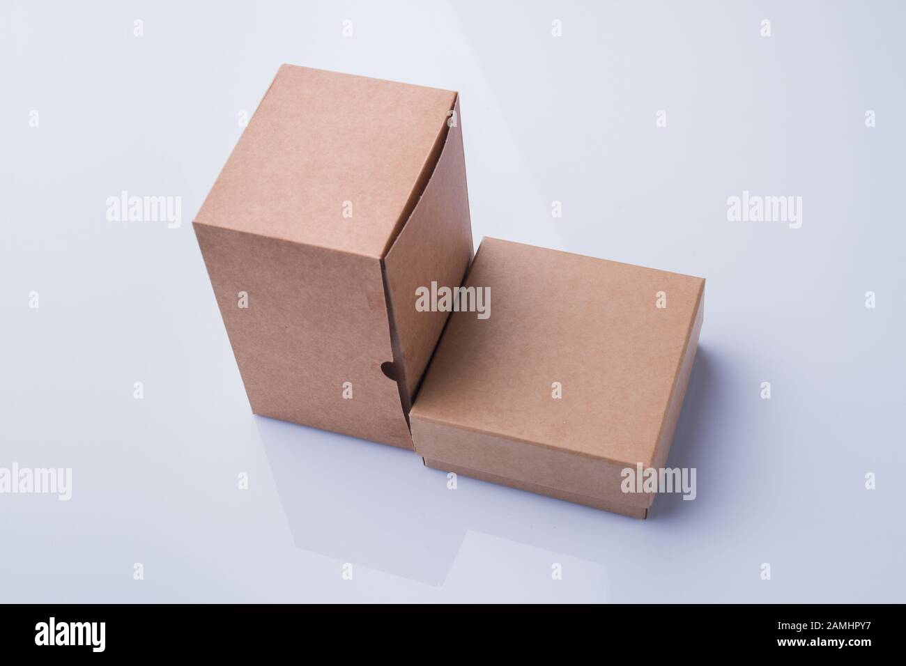 Small and tall cardboard boxes Stock Photo - Alamy
