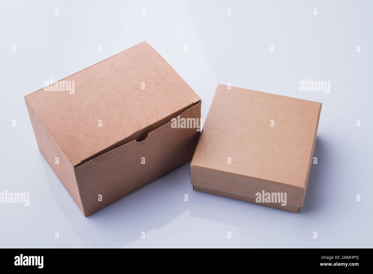 Two different cardboard boxes isolated on white Stock Photo - Alamy