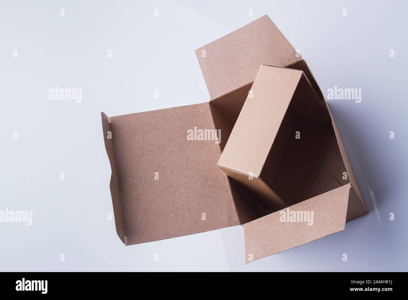 Small cardboard box inside a big one Stock Photo - Alamy
