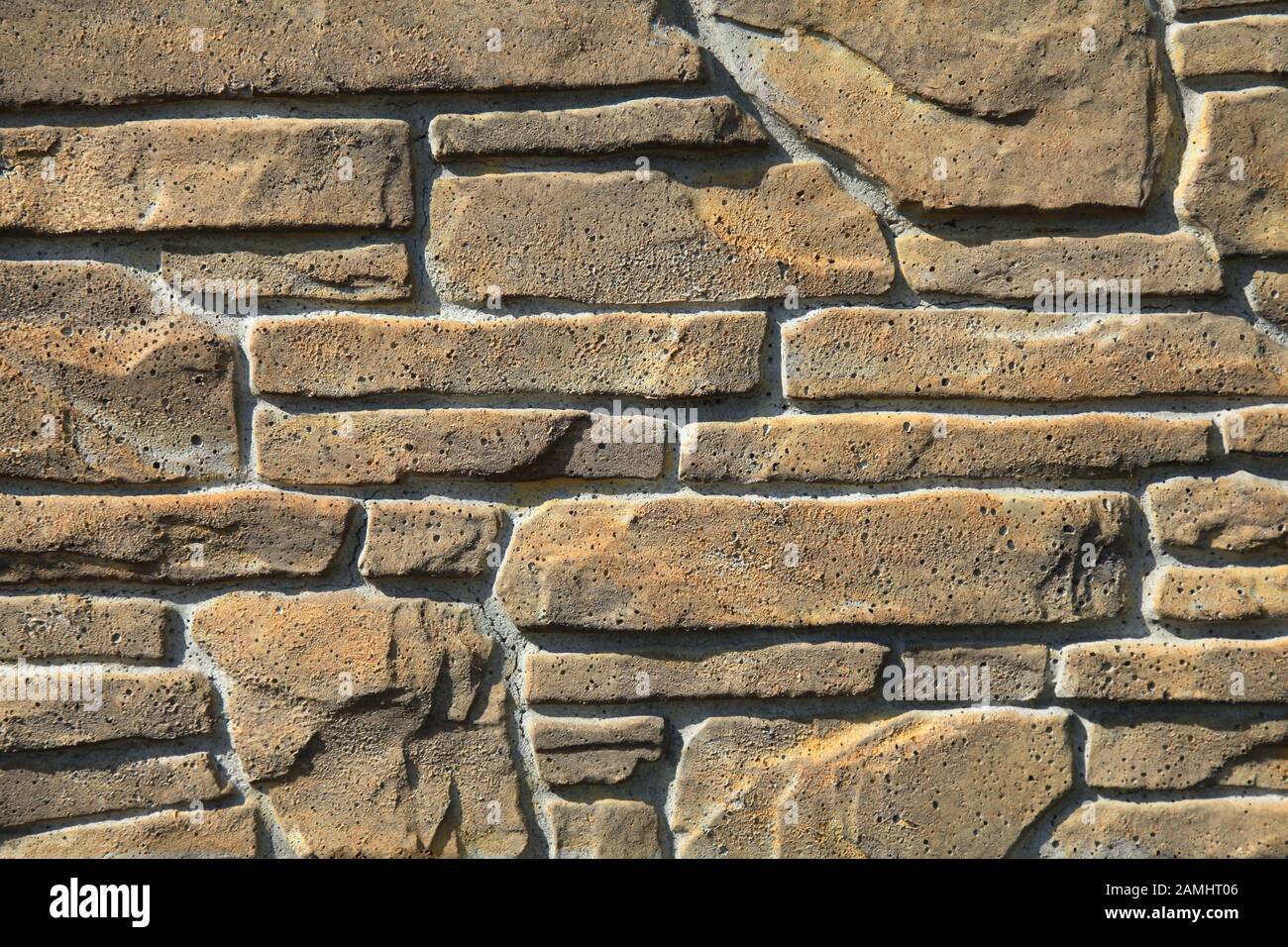 Beige-colored decorative stone wall, texture, background. Tan or light ...