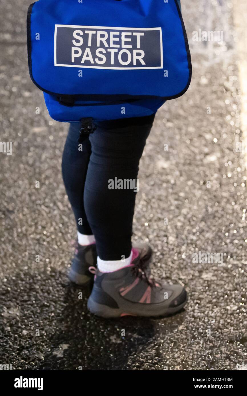 A street pastor at work in Cardiff, Wales, UK Stock Photo - Alamy