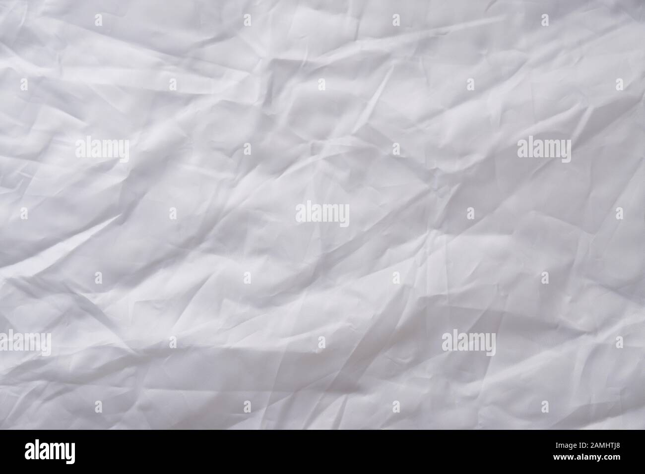 Texture of crumpled white fabric with a blue tint. White flag ...