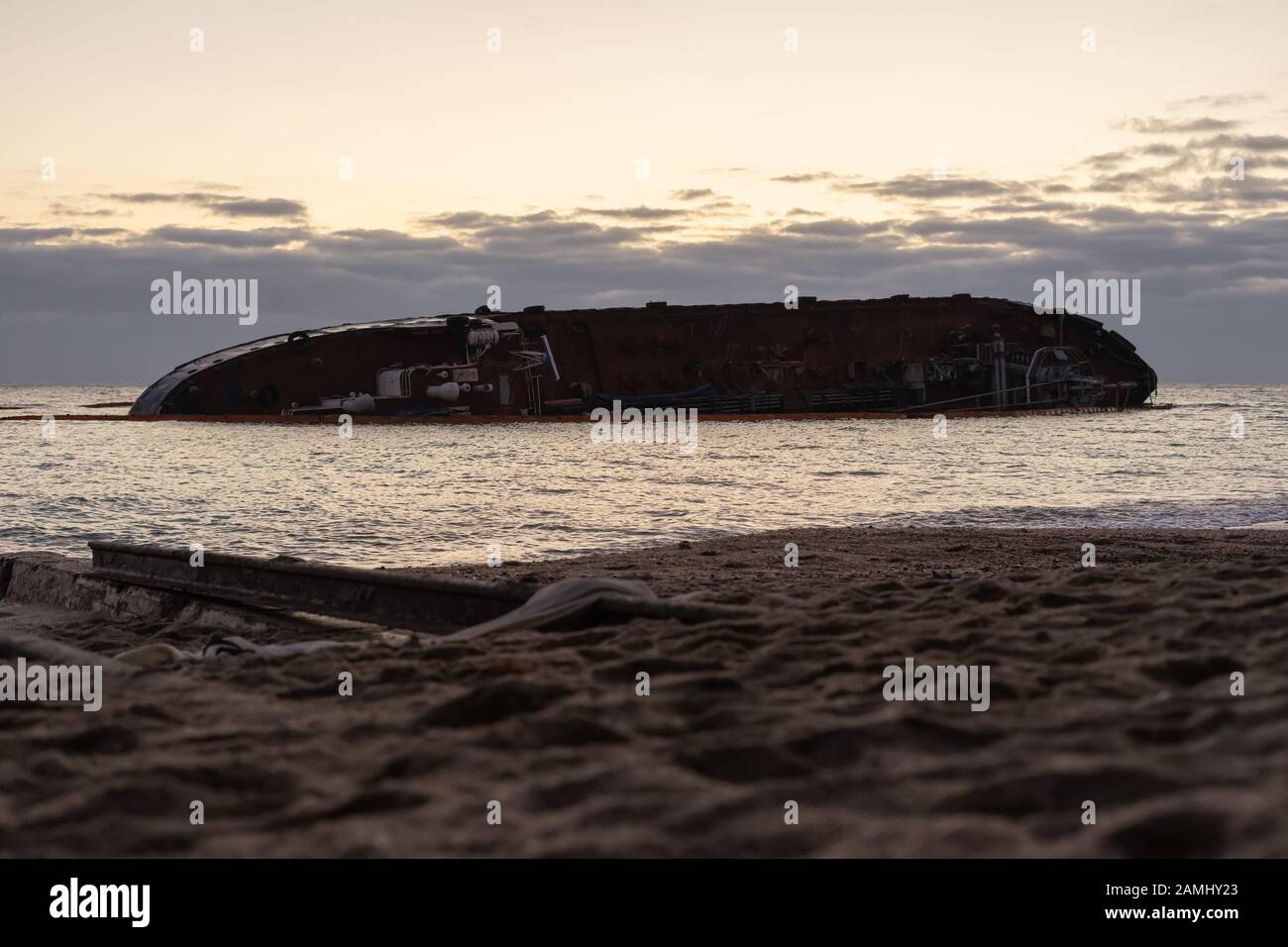 A sunken tanker off the coast of Odessa. Overcast dawn Stock Photo - Alamy