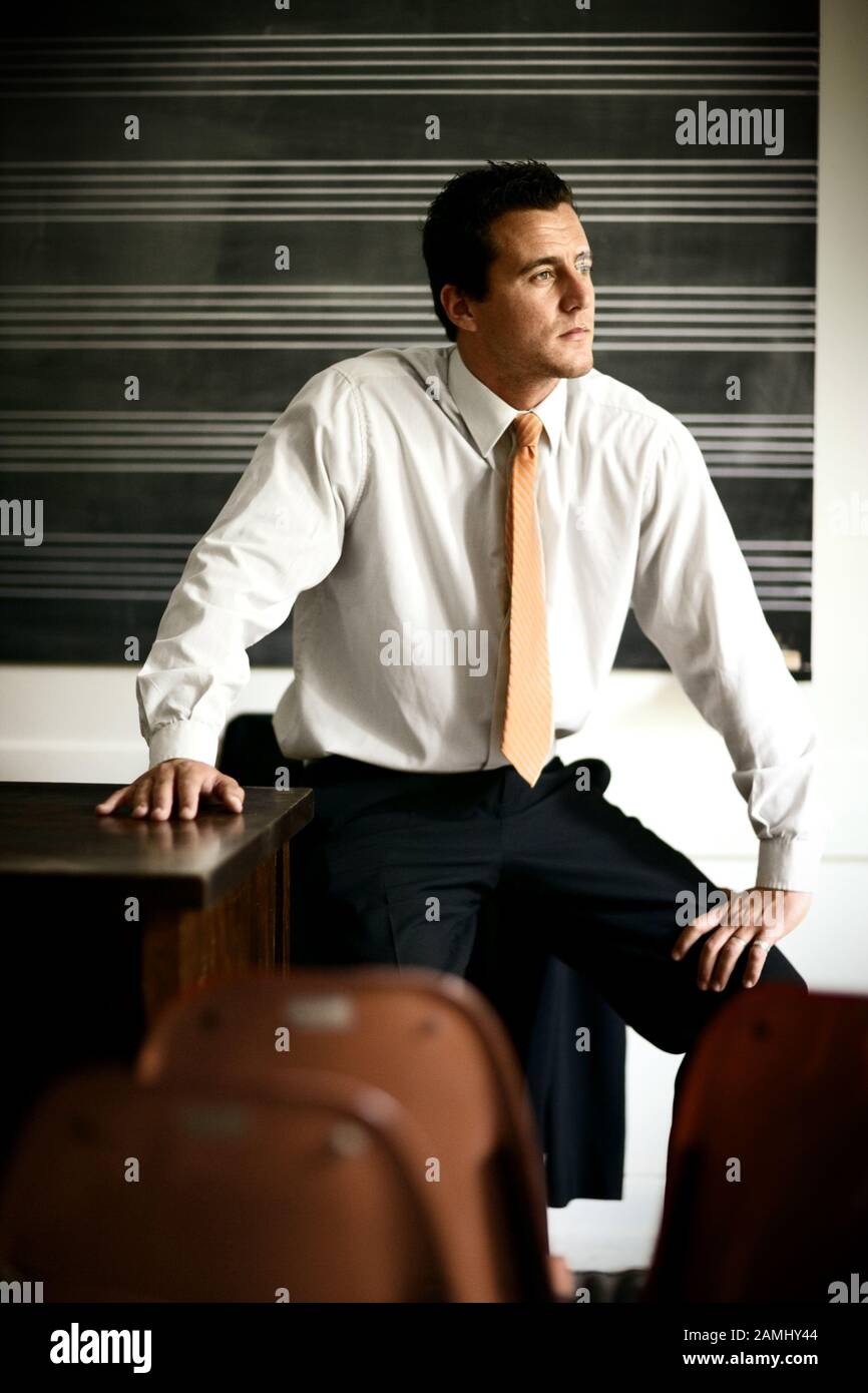 Portrait of a young man in formal attire at his office Stock Photo - Alamy