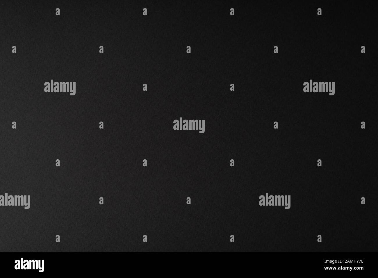 Black background from textured paper. Gradient lighting Stock Photo - Alamy