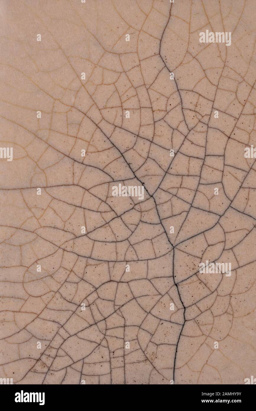 Cracked enamel. Old pottery. Cracks on a smooth surface Stock Photo - Alamy