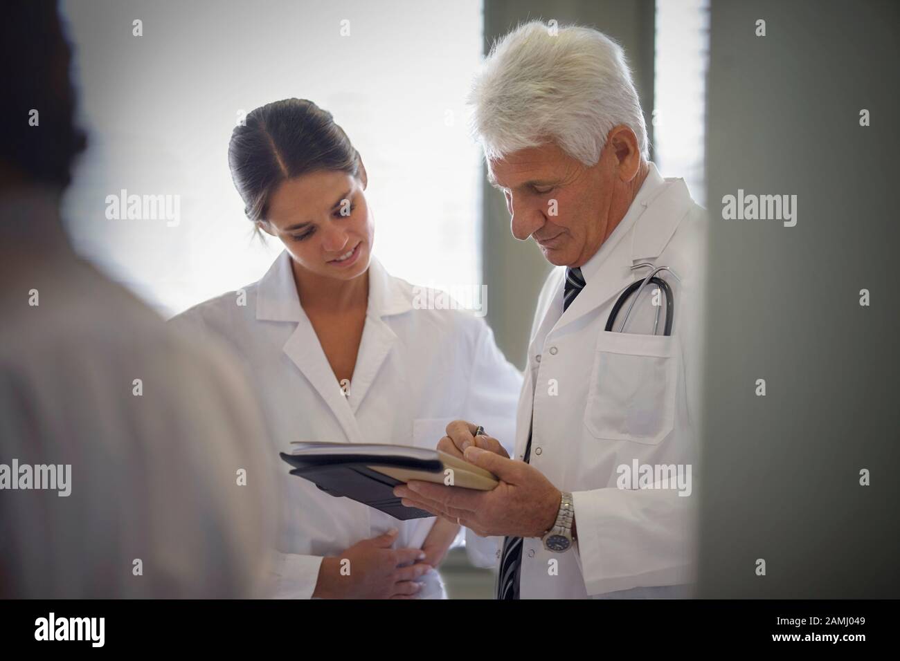 Two doctors standing side in hi-res stock photography and images - Alamy