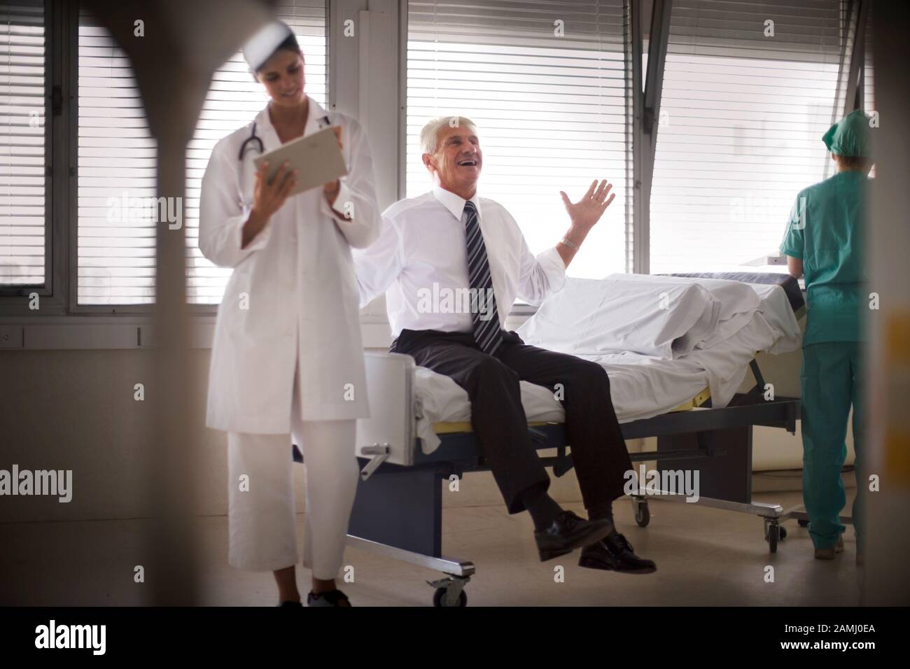 View of a doctor getting ready for medical checkup Stock Photo - Alamy