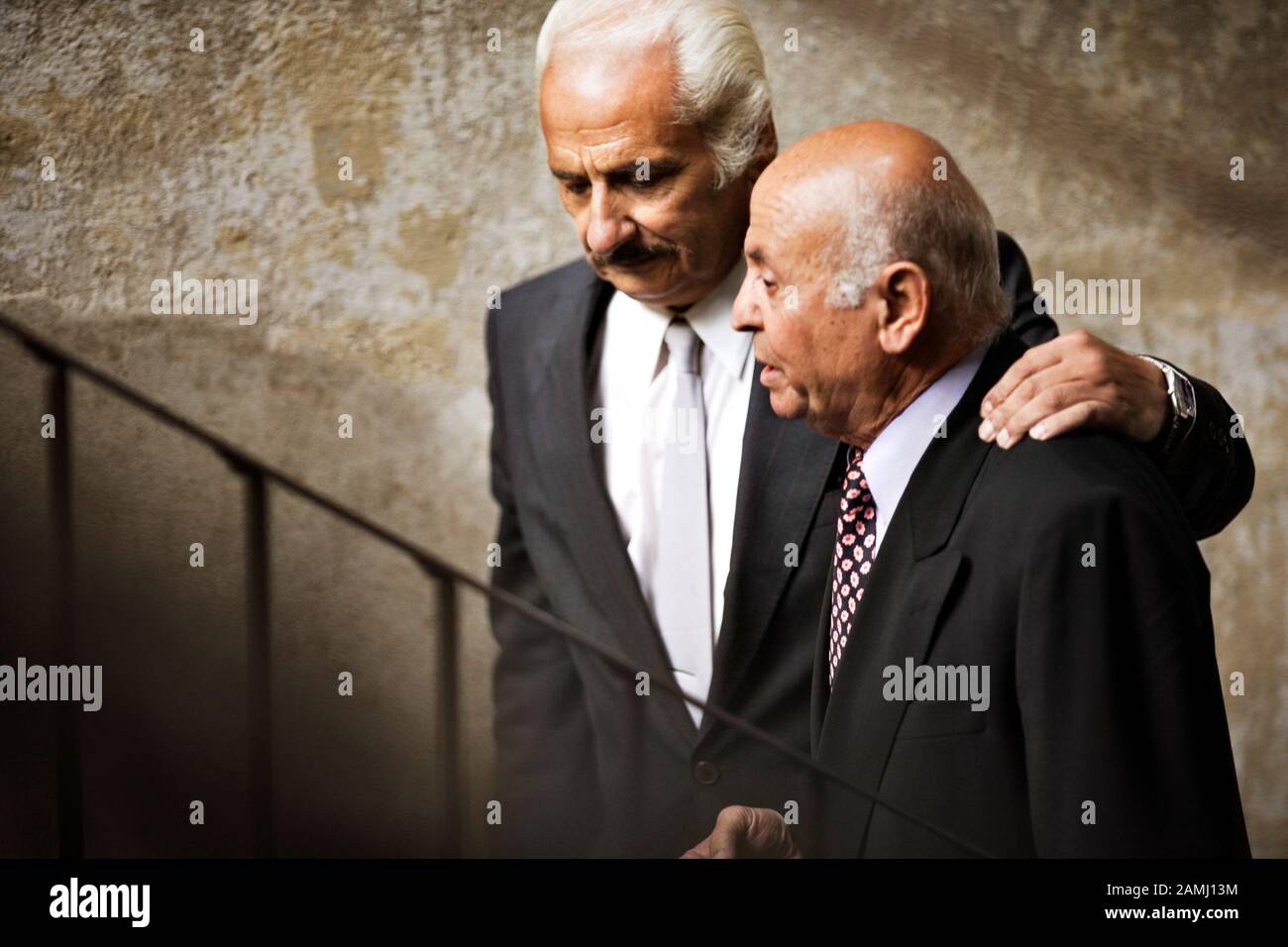 Side view of two senior men talking to each other Stock Photo - Alamy