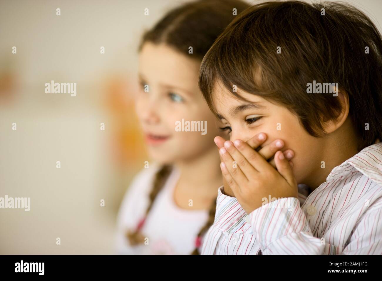 Side view of two adorable children Stock Photo - Alamy