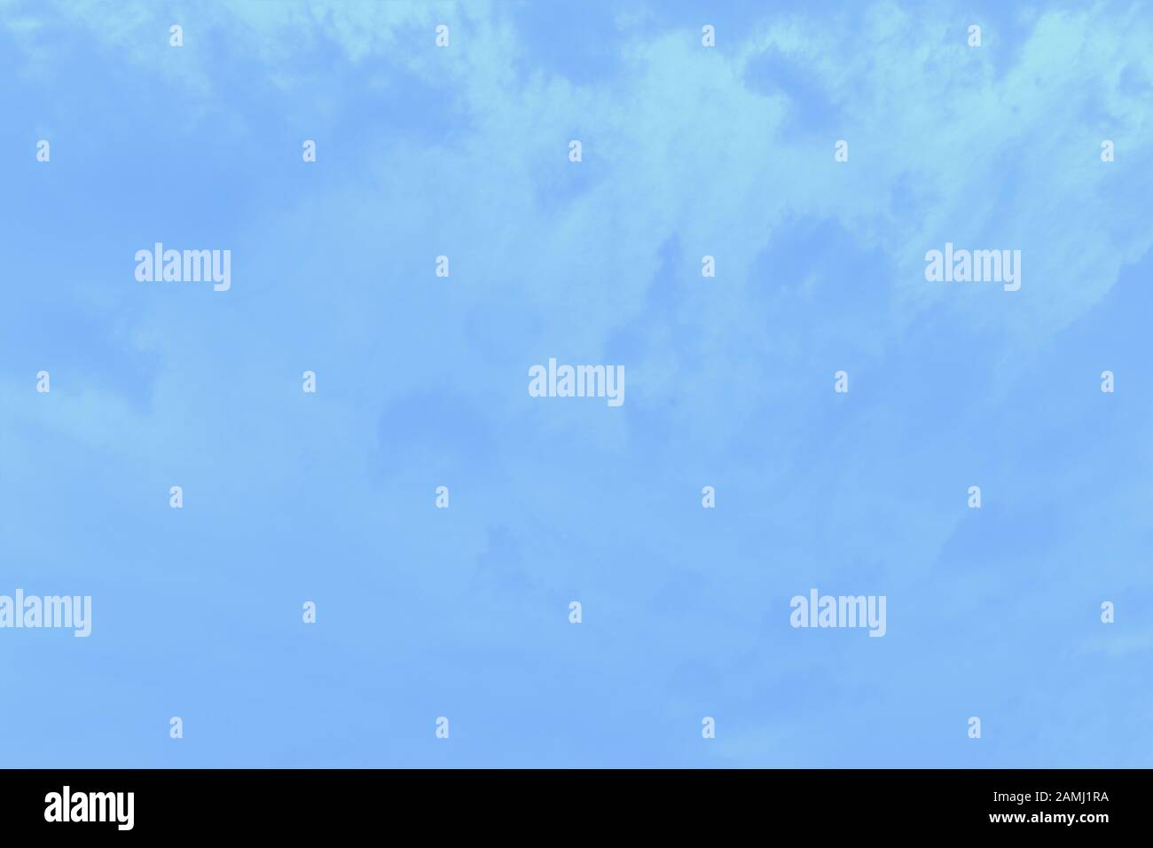 Pale blue sky background with soft delicate clouds Stock Photo - Alamy