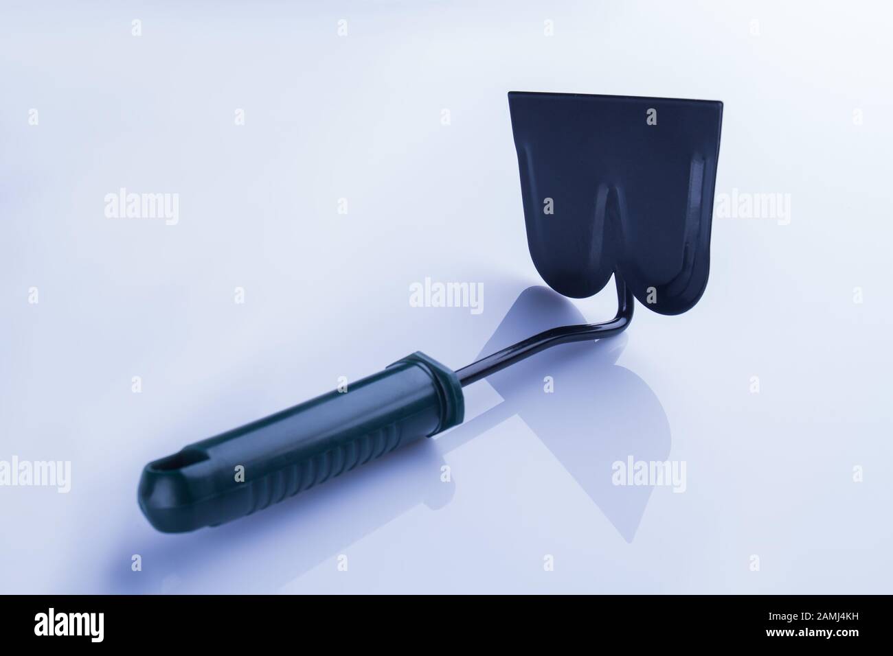 Planting hoe with short handle Stock Photo - Alamy